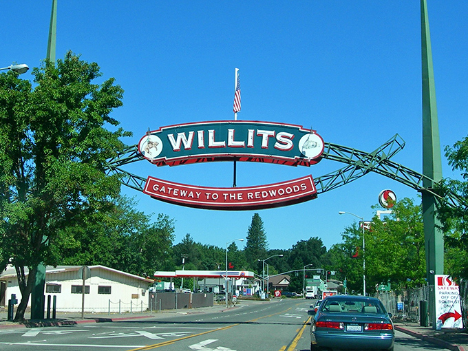 Same arch, different season! Willits shows off its sunny side, where redwood adventures begin and wallet worries end.
