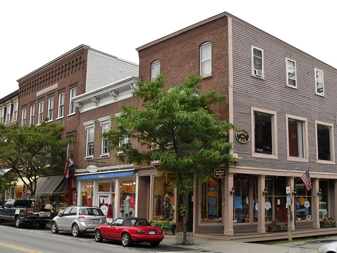 Historic brick buildings line Woodstock's bustling main drag, where modern life moves at a delightfully 19th-century pace.