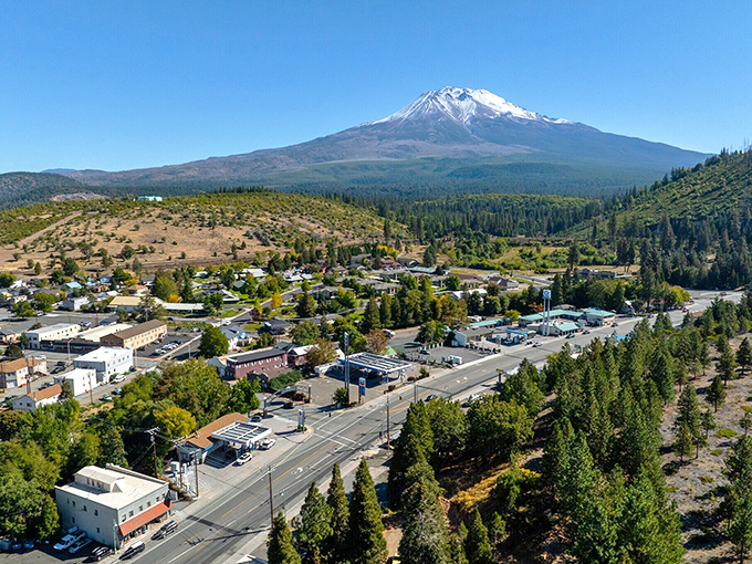 Mount Shasta stands sentinel over Weed like nature's own real estate billboard: "Million-dollar views without the million-dollar price tag!"