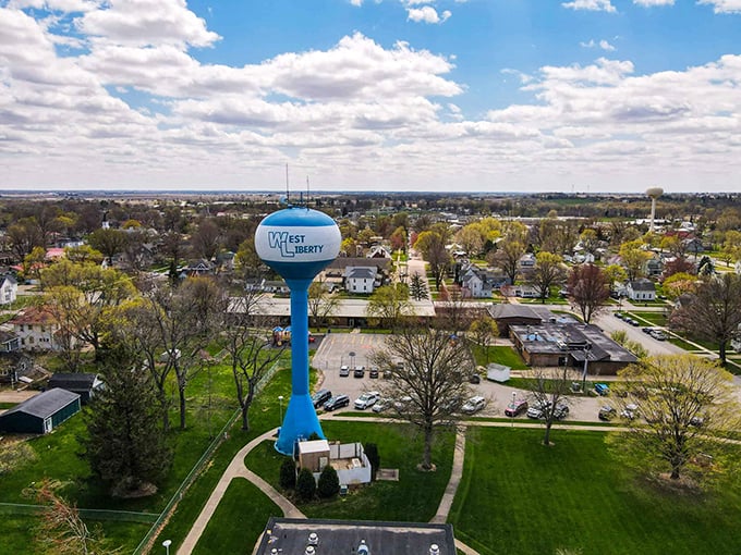 The iconic blue water tower stands sentinel over West Liberty, a beacon of small-town pride visible from miles around.