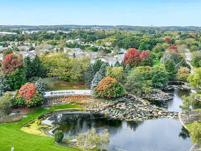 Nature's masterpiece on display! The aerial view reveals how Sun City Huntley seamlessly blends residential comfort with natural beauty, complete with a water feature that would make Monet reach for his paintbrush.