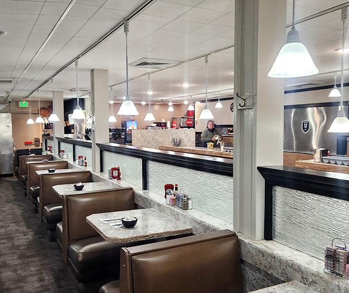 Classic diner booths line up like soldiers ready for the breakfast battle &ndash; comfortable, unpretentious, and ready for serious eating.