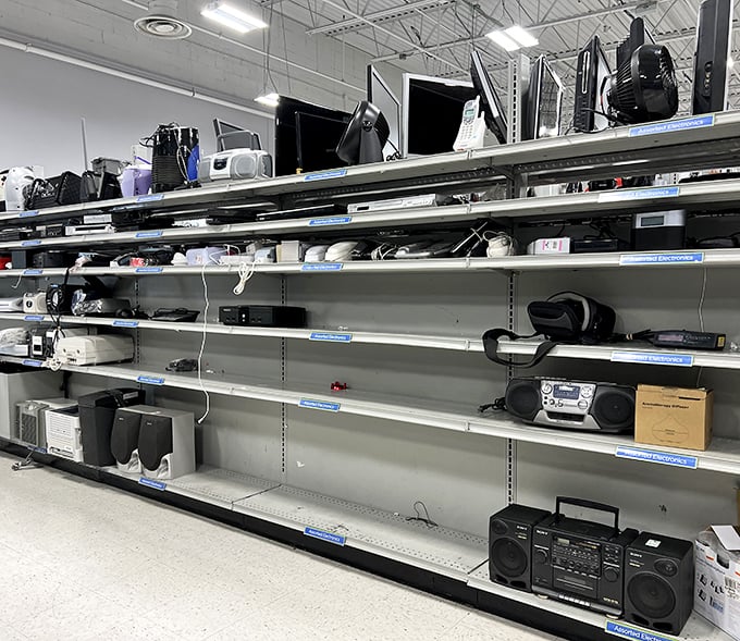 The electronics graveyard, where yesterday's must-have gadgets await resurrection. That boombox might be older than some shoppers, but it's got stories to tell.