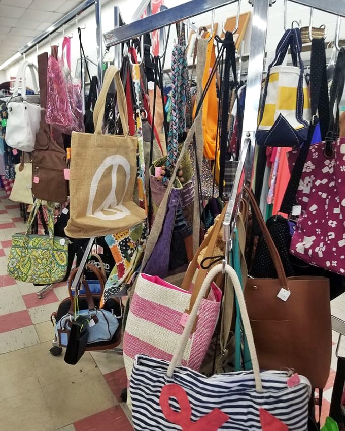 A rainbow of handbags dangles like exotic fruit, each with stories to tell and adventures to join.