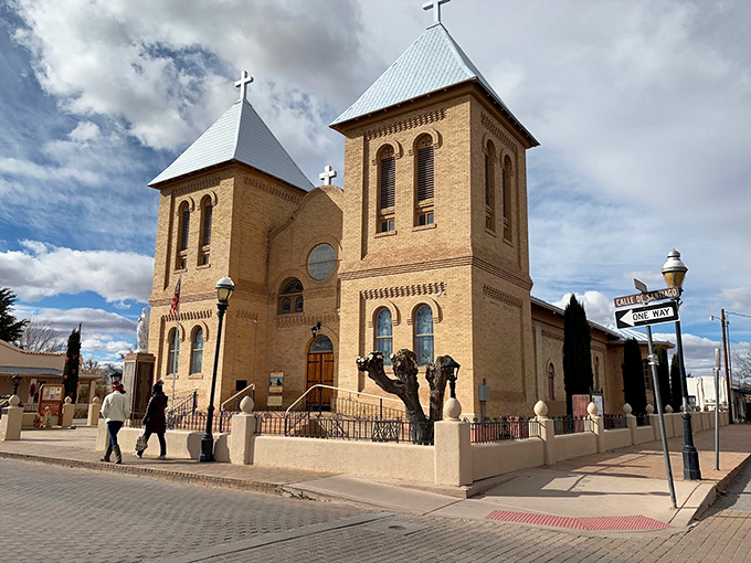 The majestic Basilica of San Albino stands sentinel over Mesilla Plaza, its twin towers reaching skyward like a spiritual lighthouse guiding the community since the 1850s.