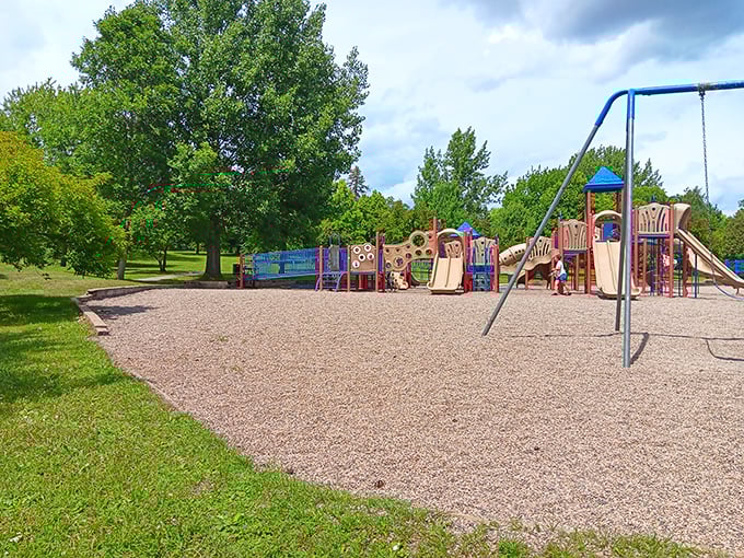 Bennett Park offers families a playground paradise where kids can burn energy while parents enjoy the shade of towering northern pines.