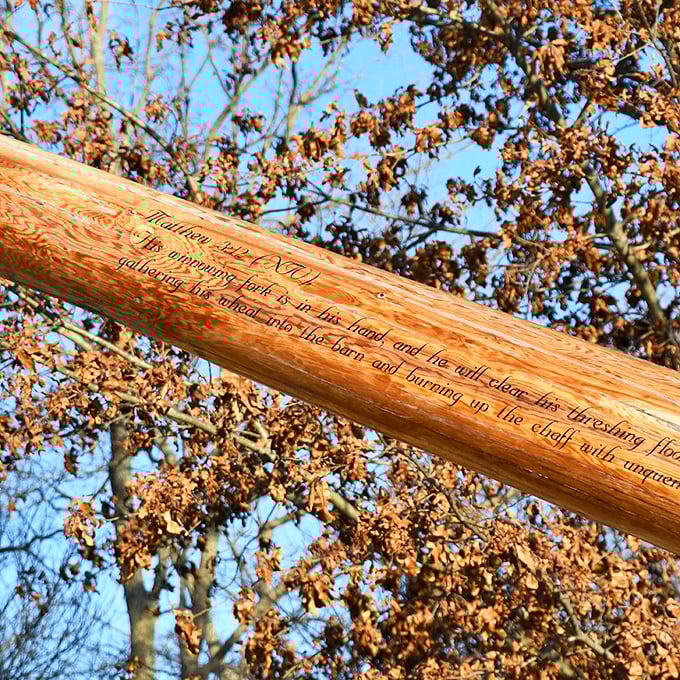 The wooden handle features a biblical inscription from Matthew, adding unexpected depth to what could otherwise be dismissed as merely roadside whimsy.