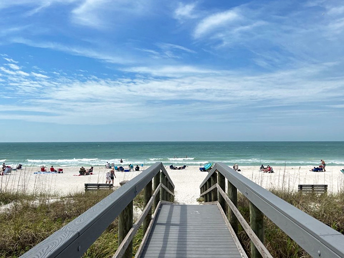 This wooden boardwalk practically begs you to kick off your shoes and feel the warm sand between your toes.