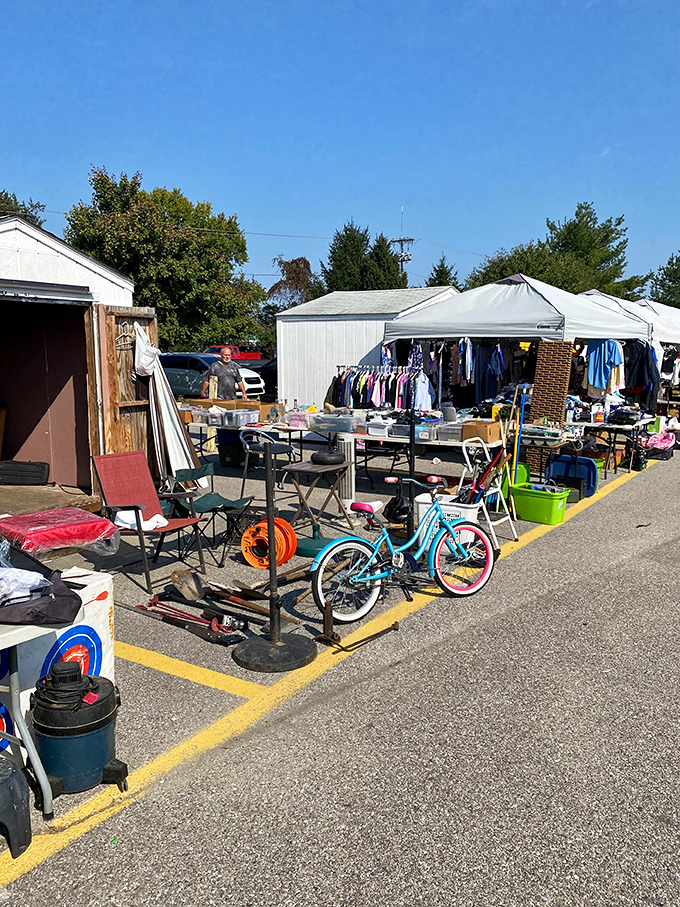 A turquoise bicycle leans casually against a table, as if saying, "Take me home!" Surrounding it, everyday objects await their second chance at usefulness.