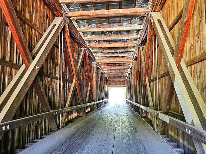 Step inside and you're transported to simpler times. The intricate wooden framework creates a cathedral-like tunnel of timber and craftsmanship.