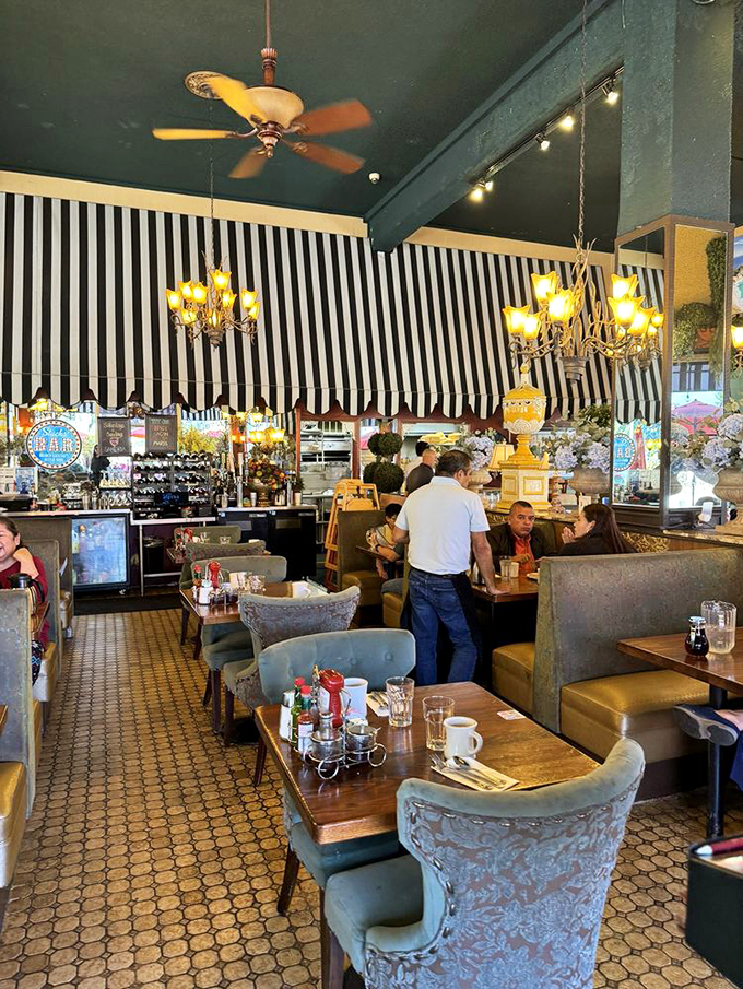 Step inside and the charm offensive continues &ndash; elegant chandeliers hanging above cozy booths while that signature striped motif ties everything together.