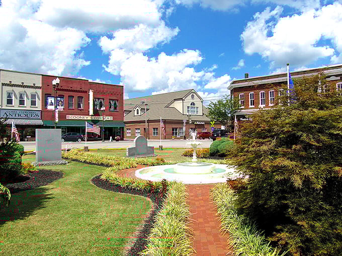 Circle Park's fountain creates a peaceful oasis amid the brick buildings of downtown, where locals gather for moments of small-town serenity.