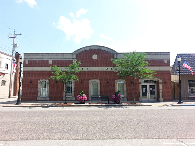 City Hall stands proudly in its brick finery, like a municipal building that dressed up for a job interview and got hired on the spot.