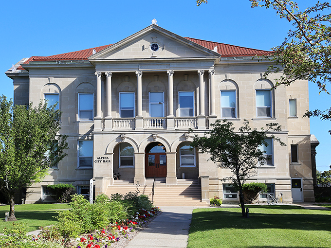 Alpena City Hall stands as a testament to small-town grandeur, its classical columns and red roof declaring, "Yes, we take our municipal business seriously, but stylishly."