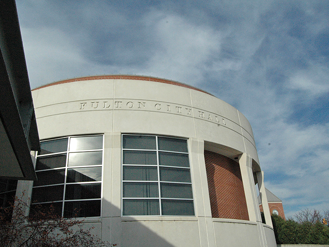 The sleek, modern Fulton City Hall blends contemporary design with small-town functionality. Its curved fa&ccedil;ade and large windows create an inviting civic space that welcomes residents and visitors alike.