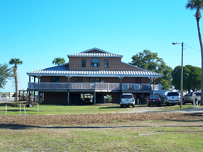 This elevated coastal building with its wraparound porch practically whispers, "Come sit a spell and watch the shrimp boats roll in."