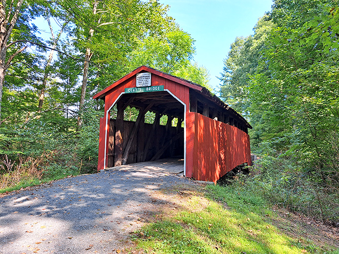 Clay's Covered Bridge stands like a time machine painted barn-red, ready to transport you to simpler days.