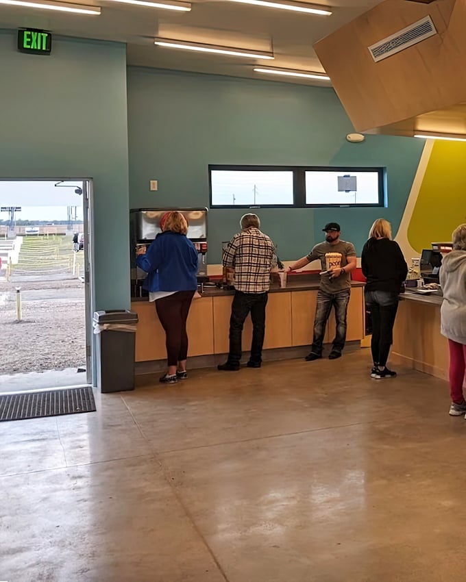 Modern amenities meet nostalgic vibes at Quasar's concession stand, where movie memories begin with the ceremonial exchange of popcorn.