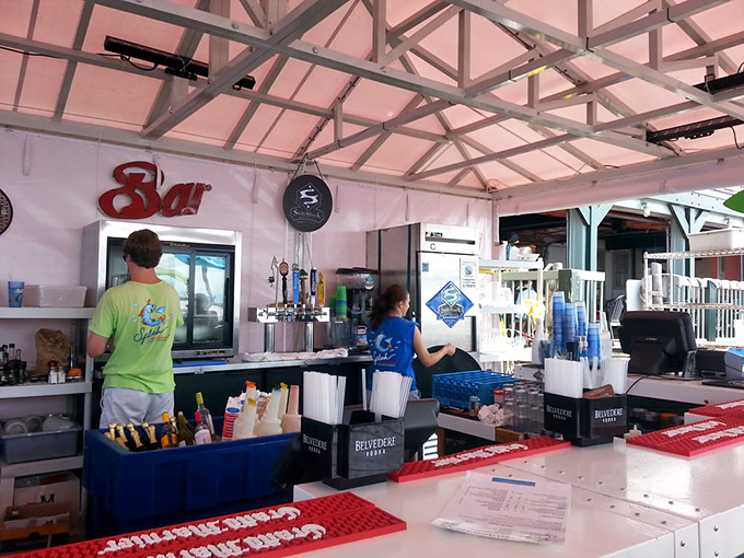 Behind every great seafood joint is a bar that knows its business. This one's ready to quench thirsts with a view that rivals the drinks.