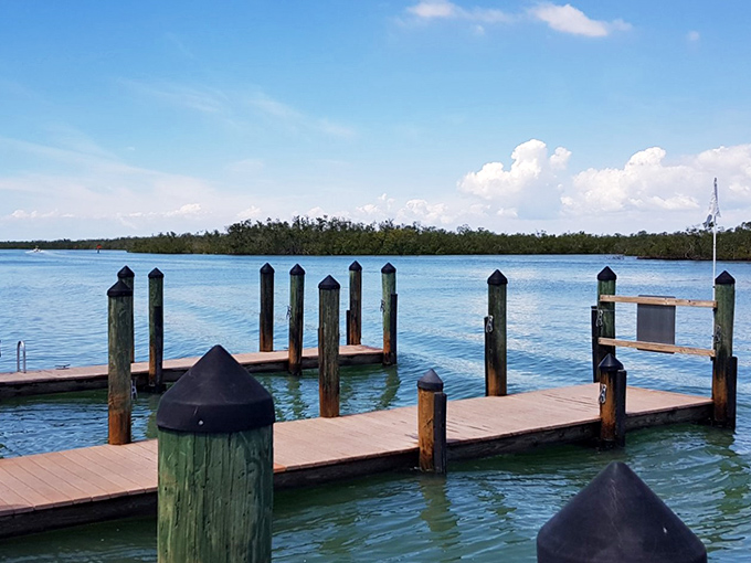 The journey begins at wooden docks like these, gateways to an island experience that feels deliciously disconnected from the mainland hustle.
