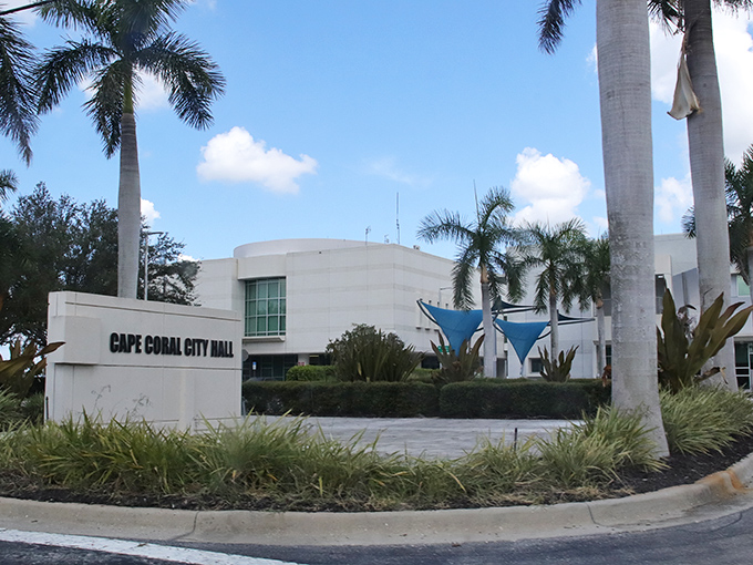 The Cape Coral City Hall stands as a modern oasis amid royal palms, proving government buildings don't have to look like Soviet-era bunkers.