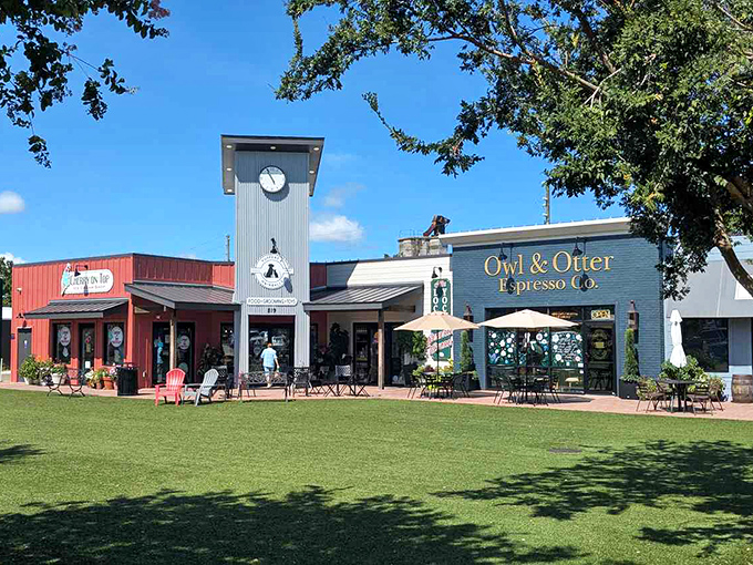 The Owl & Otter Espresso Co. anchors a charming shopping plaza where locals gather under Florida's endless blue skies.