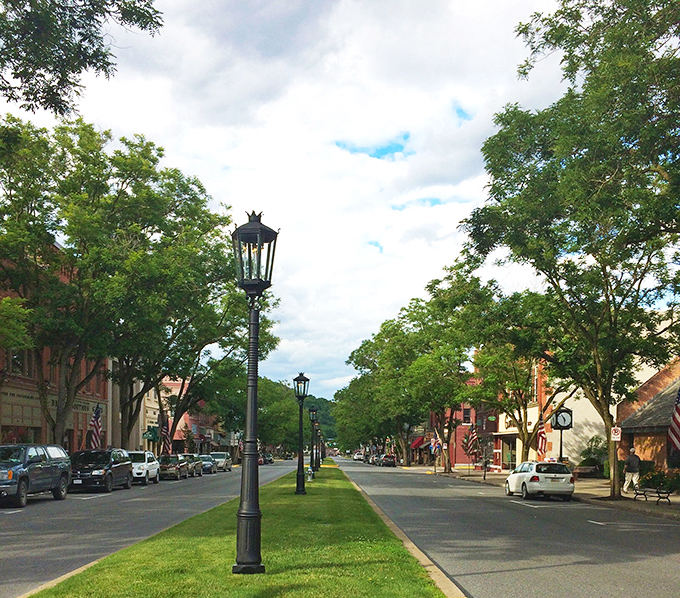 Main Street's grassy median and historic storefronts create the kind of downtown that makes big-city dwellers question their life choices.