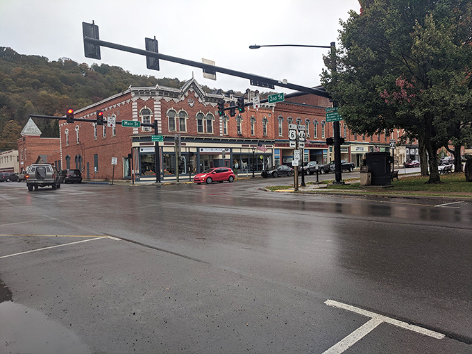 Rain-slicked streets reflect the historic charm of downtown Coudersport, where time seems to move at a more civilized pace than the outside world.