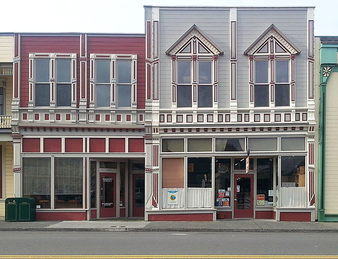 These aren't just pretty storefronts—they're time machines with cash registers. The meticulous Victorian details make modern strip malls look like they're not even trying.