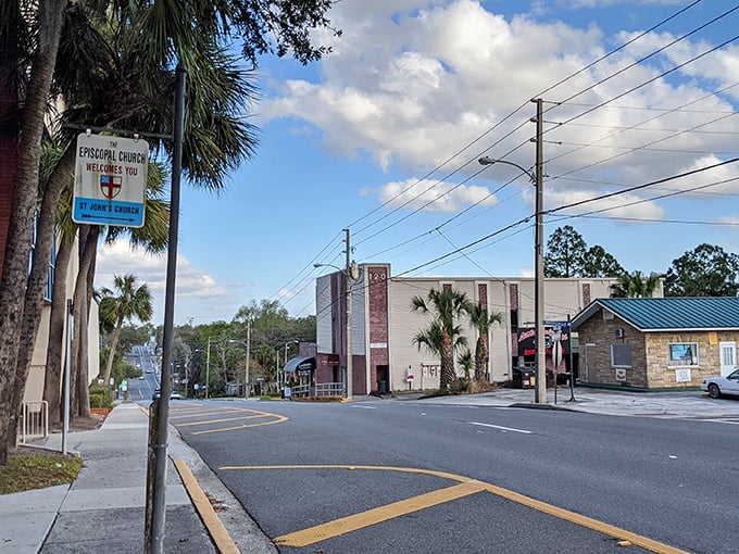 The Episcopal Church welcomes visitors with the same gentle grace as the palm trees that frame this quiet intersection.