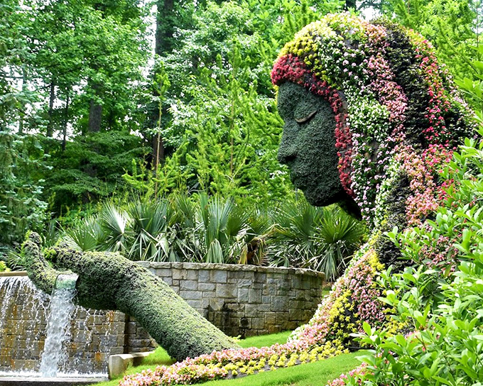 Mother Nature herself seems to have taken form, this Earth Goddess sculpture cradles a waterfall in her palm while watching over her botanical kingdom.