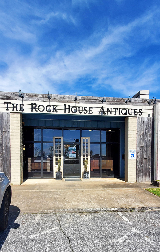 Blue skies above, history within. The Rock House's weathered wood and cream brick fa&ccedil;ade promises adventures in antiquing.