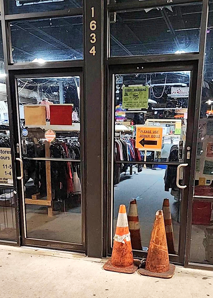"Please use other door" &ndash; the first instruction on your journey to thrifting nirvana. Orange cones guard the gateway to affordable wonders.