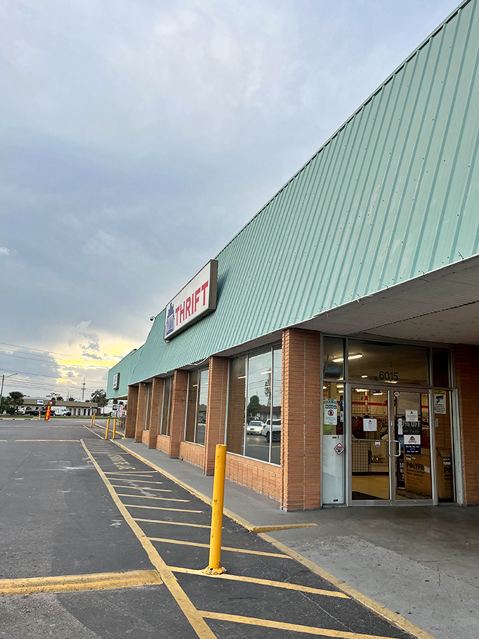Sunset casts a golden glow on City Thrift's entrance, where tomorrow's vintage finds await behind those unassuming glass doors.