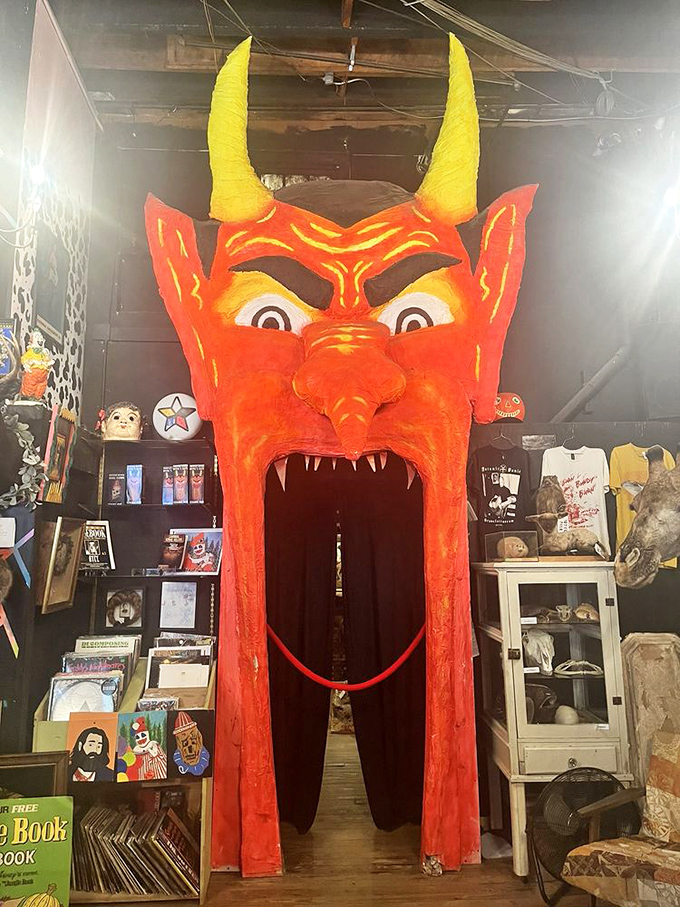 Step through this devilish doorway if you dare. The massive red demon head serves as a portal between exhibits, proving some museums really do have a sense of humor.