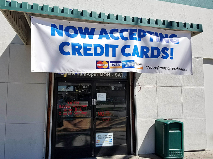 The modern era meets vintage shopping with that "NOW ACCEPTING CREDIT CARDS!" banner&mdash;your wallet's permission slip for guilt-free treasure hunting.