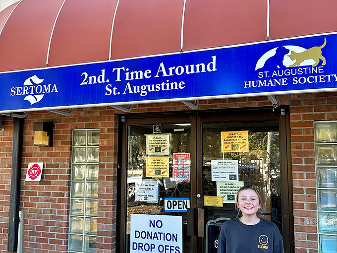 The iconic red awning marks the spot where bargain hunting dreams come true. This unassuming entrance is Florida's portal to secondhand splendor.