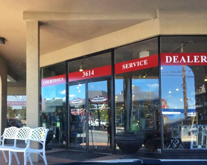 The entrance promises "COURTEOUS SERVICE" in bold red letters &ndash; the retail equivalent of a warm Georgia welcome without the humidity.