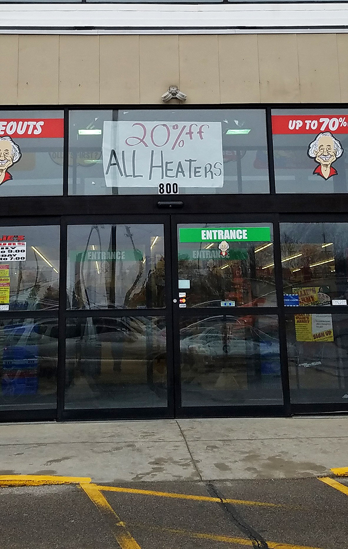 Hand-written signs advertising 20% off heaters &ndash; the kind of analog charm that reminds you this isn't your algorithm-driven shopping experience.