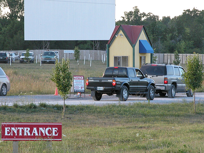 The iconic yellow ticket booth stands sentinel at the entrance, a cheerful gatekeeper to evenings of cinematic wonder under Tennessee stars.