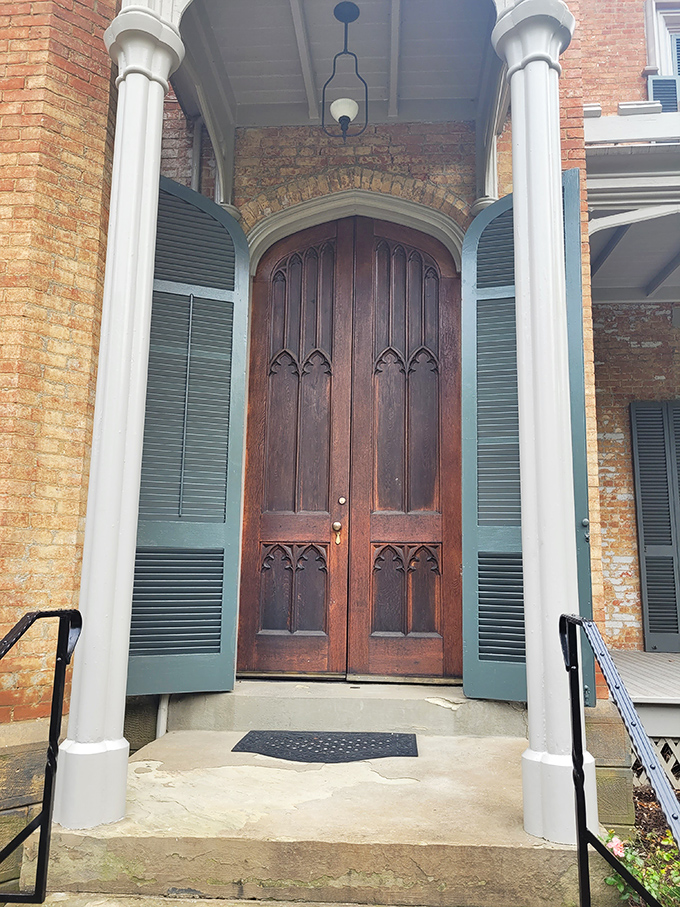 These aren't just doors&mdash;they're time portals to the 1850s. The Gothic arches and hefty woodwork scream "important people lived here" in the most charming way.