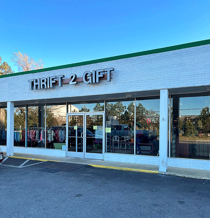 Morning light bathes the storefront in golden hues, highlighting racks of clothing visible through spotless windows. The thrill of the hunt awaits.
