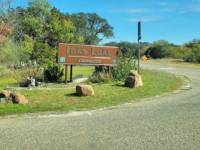 Even the entrance sign looks relaxed, surrounded by wildflowers that couldn't care less about your schedule.