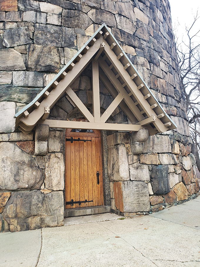 The tower's entrance could double as a portal to Narnia—complete with rustic wooden door and storybook stonework that practically whispers "once upon a time."