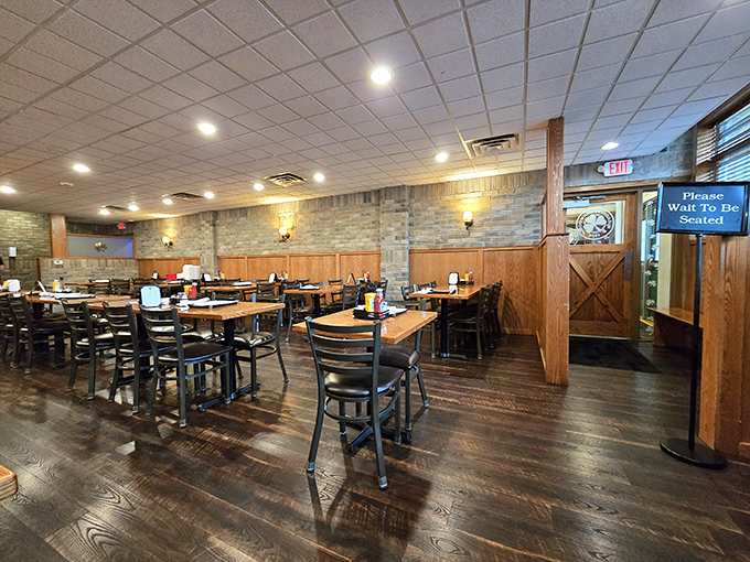Wood paneling, stone accents, and that "Please Wait To Be Seated" sign &ndash; the universal language for "good things come to those who wait."
