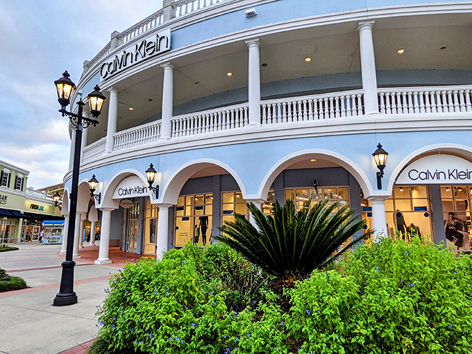 Calvin Klein's storefront embodies the outlet's elegant design philosophy&mdash;where bargain hunting happens beneath white columns that would make Thomas Jefferson nod in approval.