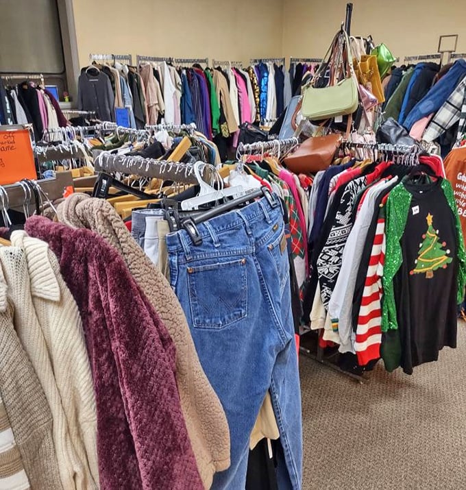 Fashion finds hang in colorful rows, from cozy sweaters to holiday-themed tees. Who knew bargain shopping could look like a boutique experience?