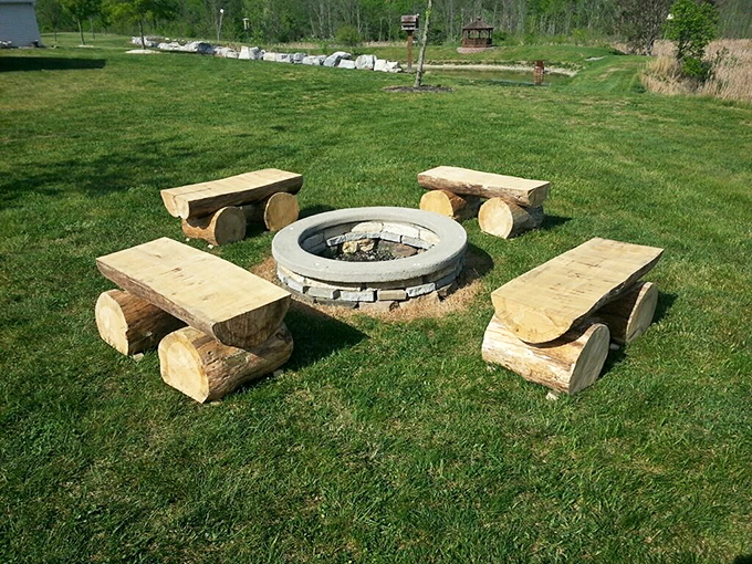 Rustic luxury at its finest &ndash; these handcrafted log benches surrounding a stone fire pit create the perfect spot for evening stories and marshmallow roasting.