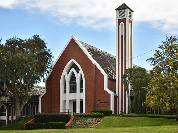 First Presbyterian Church reaches skyward with its striking steeple, a spiritual landmark where stained glass and Southern hospitality create a welcoming sanctuary for all. 