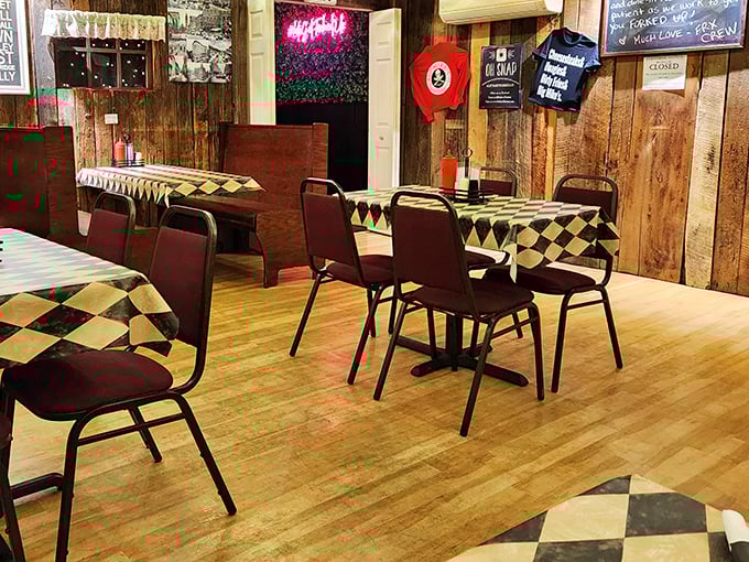 Checkered tablecloths and wooden paneling create that rare atmosphere where you instantly feel like a regular, even on your first visit.